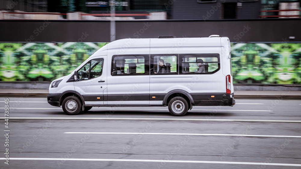 Ford Transit Fourth generation in the city street. Side view of white ...