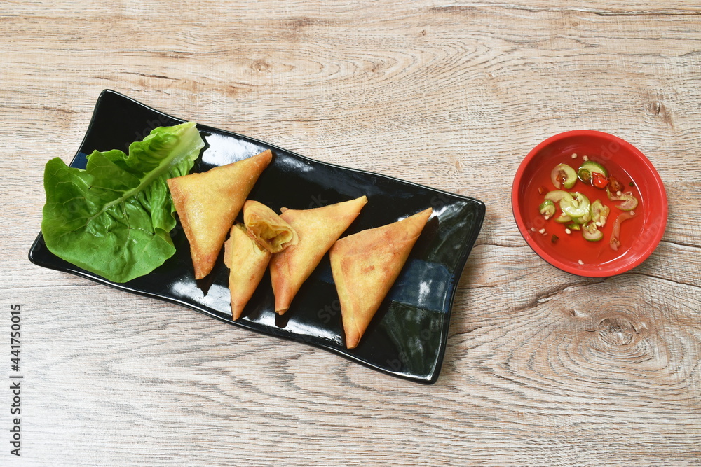 batter fried samosa Indian food made by floor stuffed chicken with ...