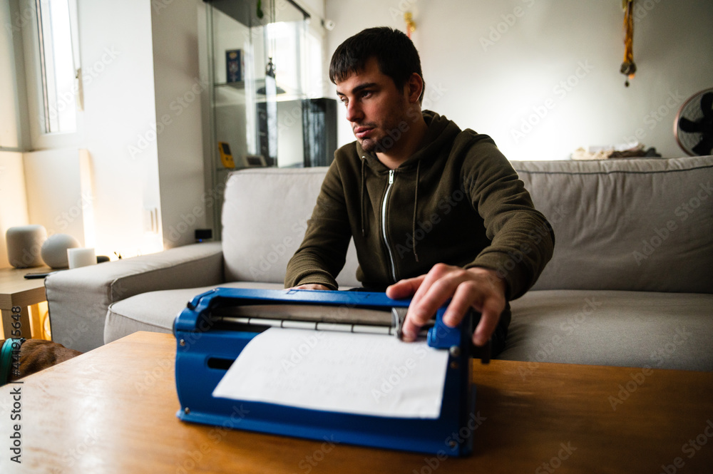 Blind man typing on typewriter with braille code Stock Photo | Adobe Stock
