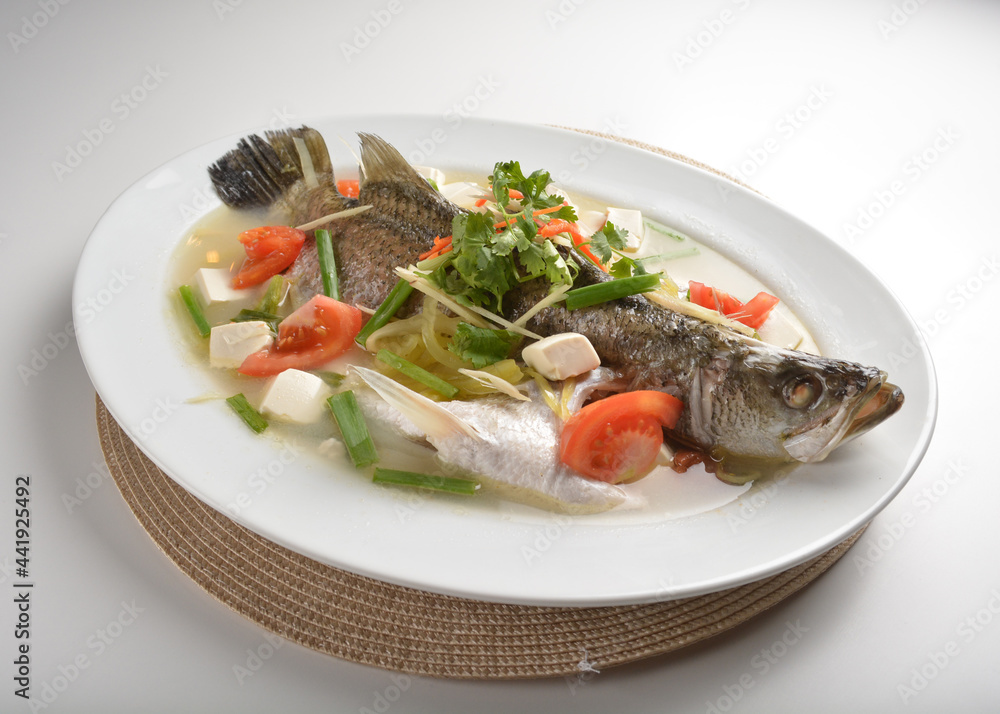 steamed fresh whole grouper fish with beancurd, tomato, sour vegetable ...