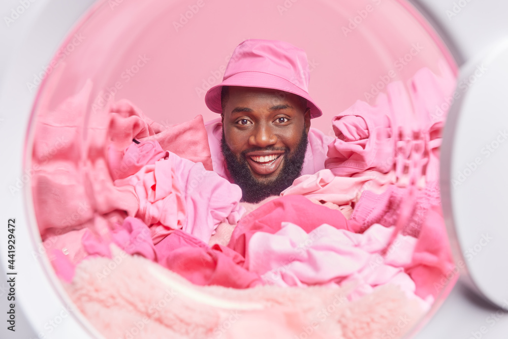 Bearded cheerful African American man photographed from inside of ...
