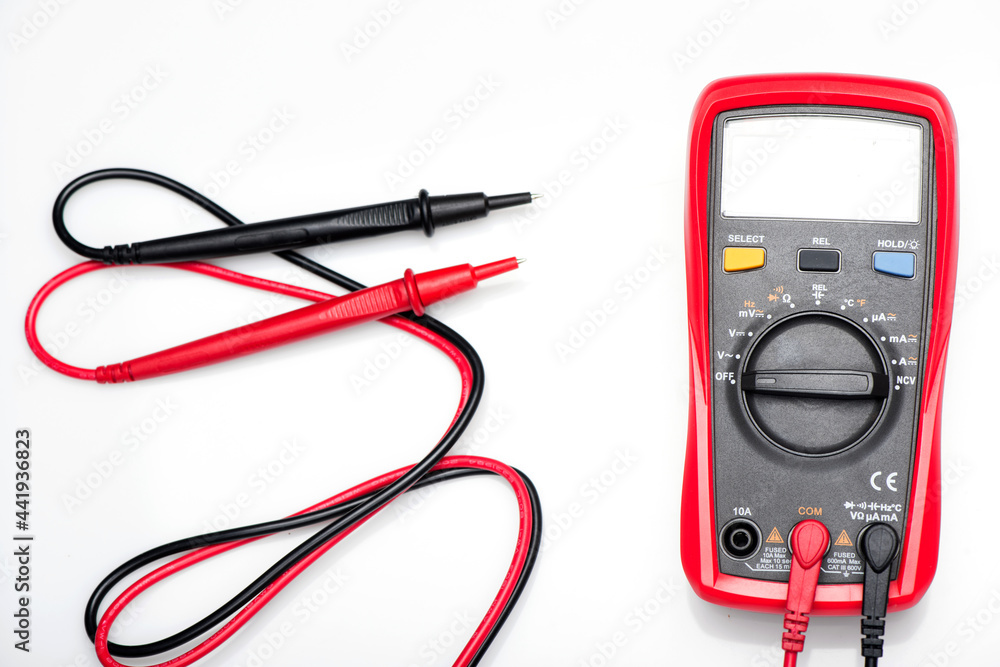 Electronic digital multimeter isolated on white with probes. Digital ...