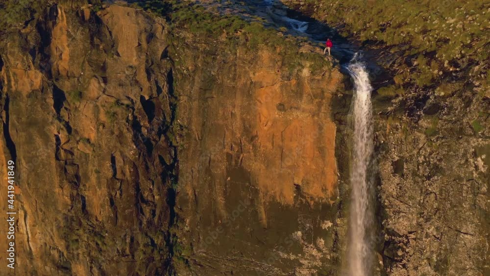 Spectacular aerial view of tourists standing on top of the magnificent ...