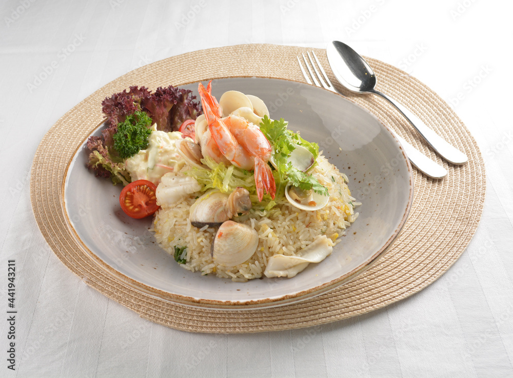 chef wok fried rice with seafood prawn, octopus and fish with salad ...