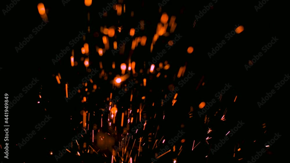 Fire sparks rising up with black background can be used for overlay for ...