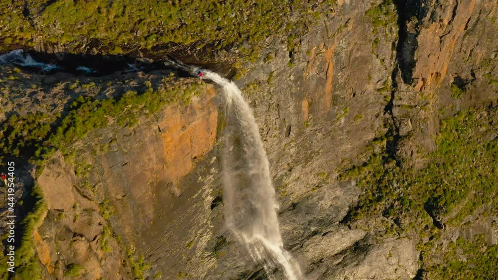 Spectacular aerial view of a tourist standing and admiring the ...