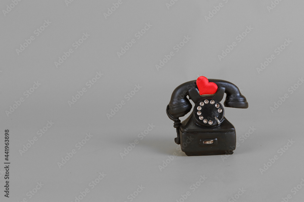 old phone with red heart Stock Photo | Adobe Stock