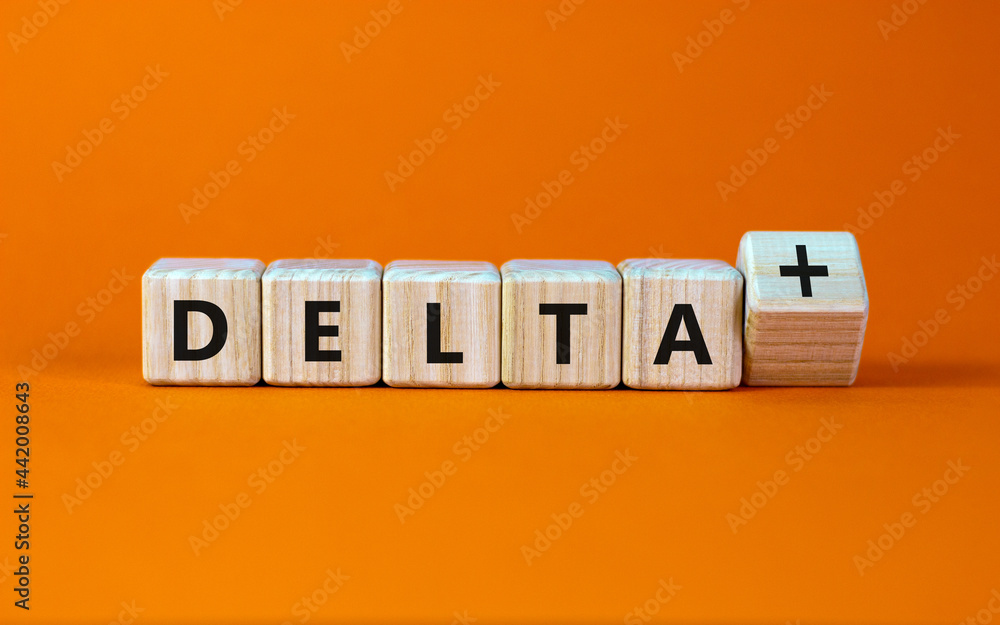 Covid-19 delta plus variant symbol. Turned the wooden cube and changed ...