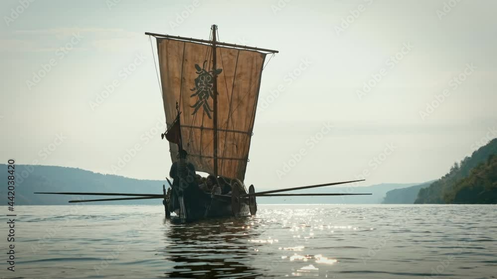Medieval Ship with Vikings on Board Sails in the Middle of the River in ...
