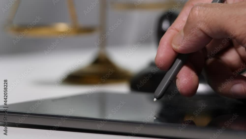 Lawyer take a tablet to search for information decide an auction or ...