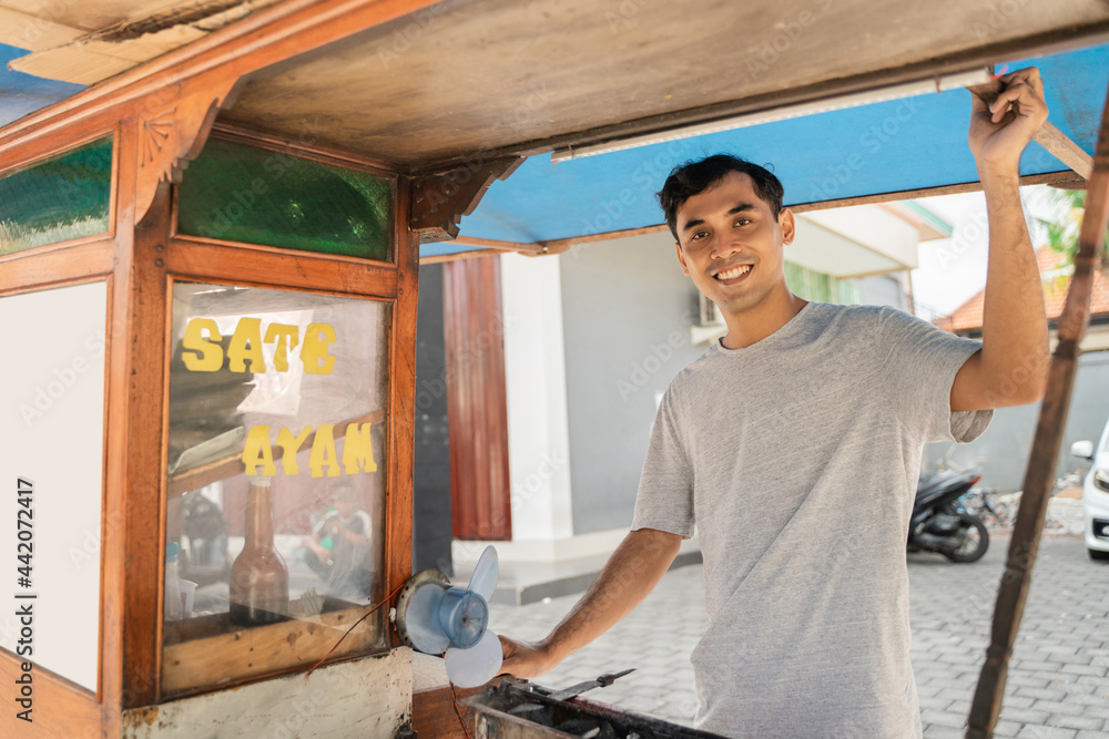 street food seller with walking stall of indonesian Chicken Satay ...