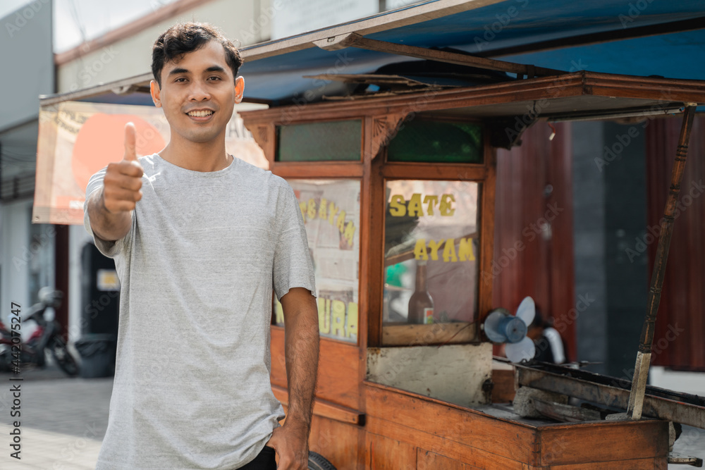 street food seller with walking stall of indonesian Chicken Satay ...