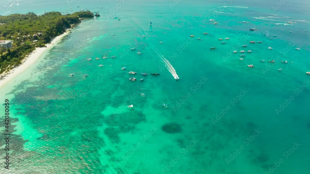 Lagoon with turquoise water and speed boat, top view. Seascape with ...