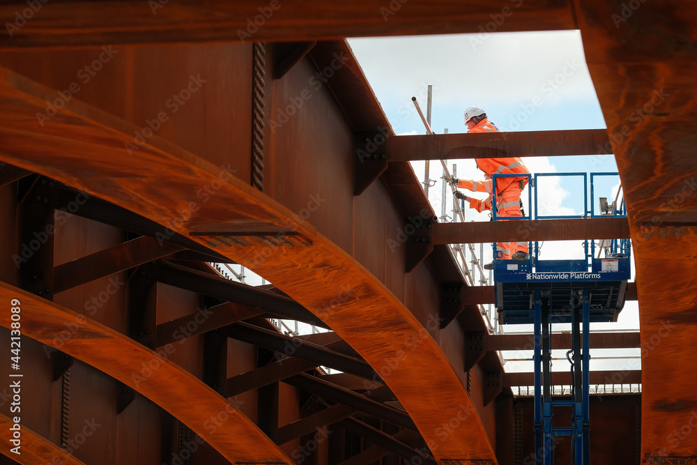 Construction Workers working at height on a new bridge which is part of ...