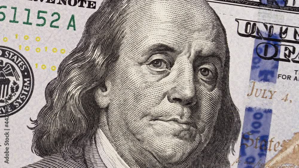Smiling portrait of Benjamin Franklin with a glaring flash in his eye ...