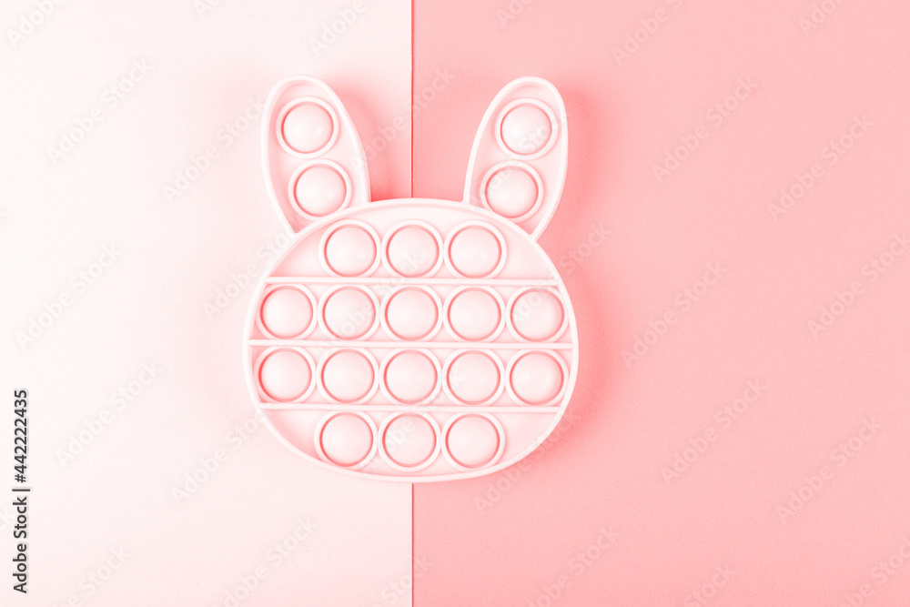 New silcone toy pop it in shape of bunny on the pink background. New ...