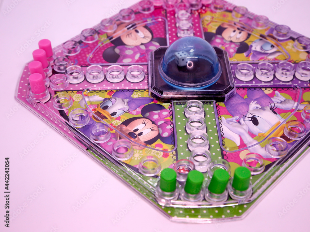 Minnie Mouse and Daisy Duck board game. Ludo game. Traditional game for ...