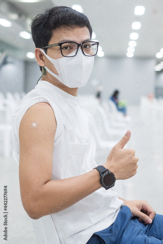 Happy man showing thumb after receiving vaccine. Vaccination ...