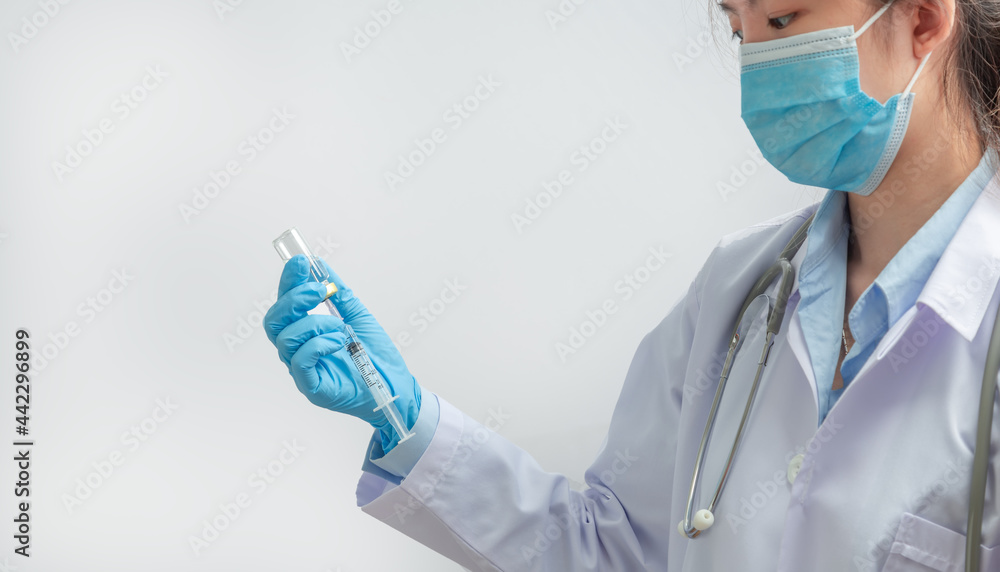 Doctor or scientist filling syringe with medication in the laboratory ...