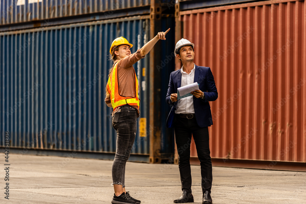Container Depot chief talking to female foreman about custom goods ...