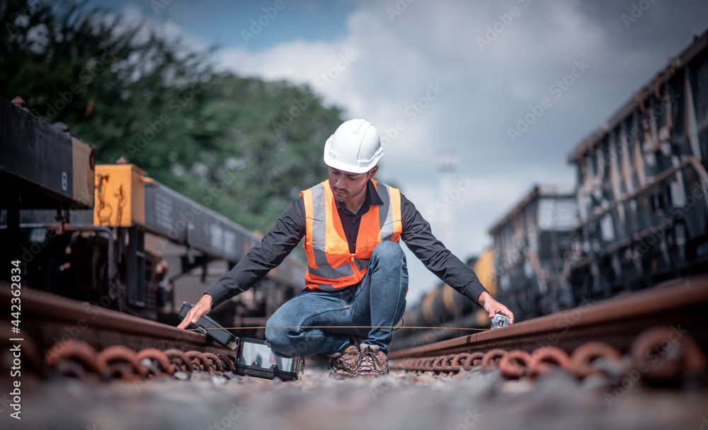 Engineer under inspection and checking construction process railway ...