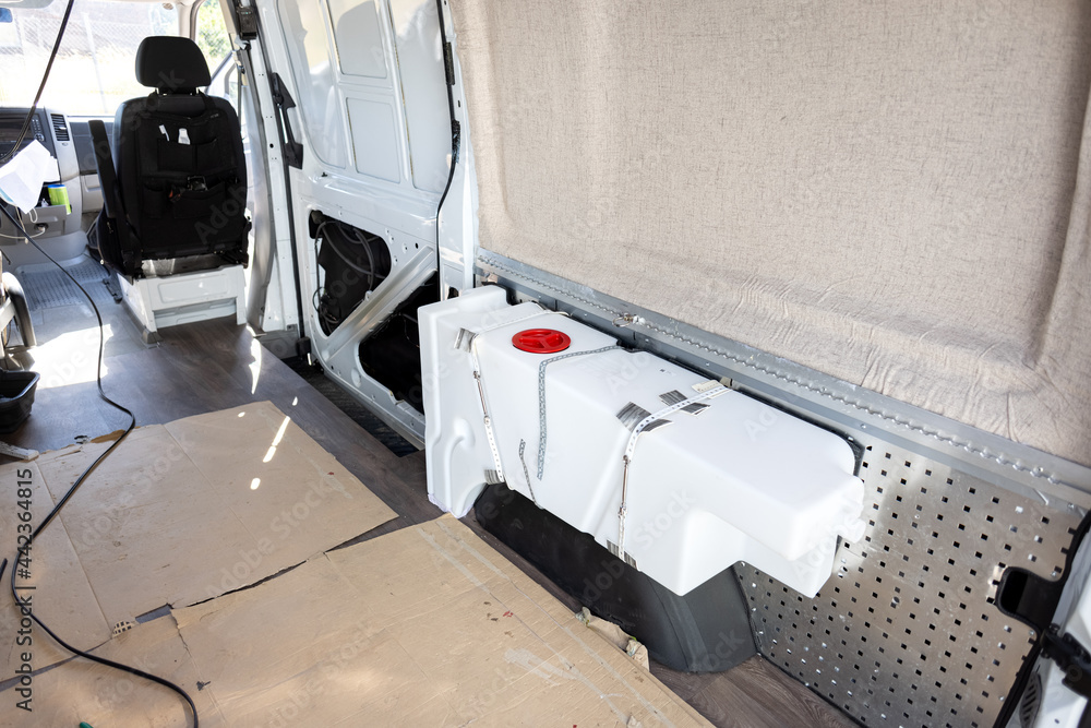 Water tank inside an empty camper van Stock Photo | Adobe Stock