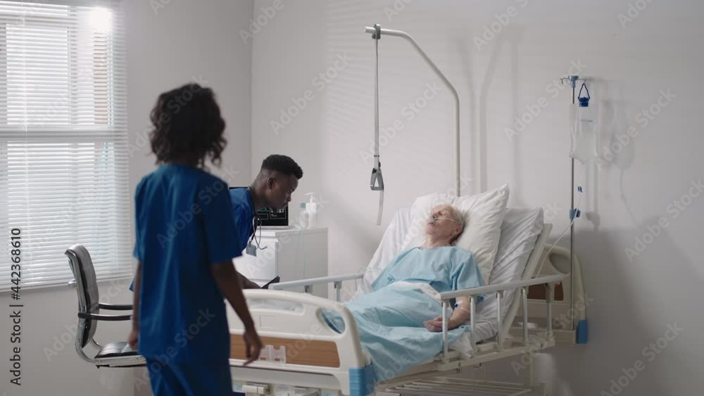 A team of african ethnic group doctors a man and a woman talk to an ...