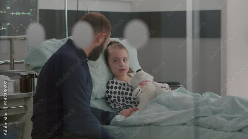 Father holding sick daughter hand explaining medication treatment ...