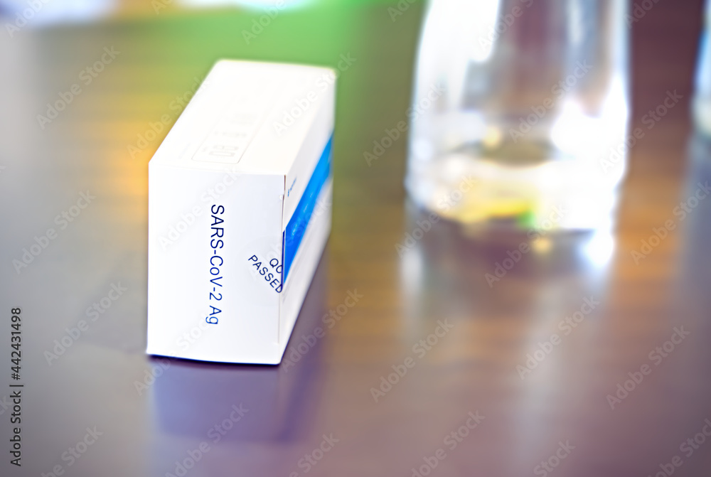 White box of drugstore spit coronavirus Covid-19 test on a table with ...