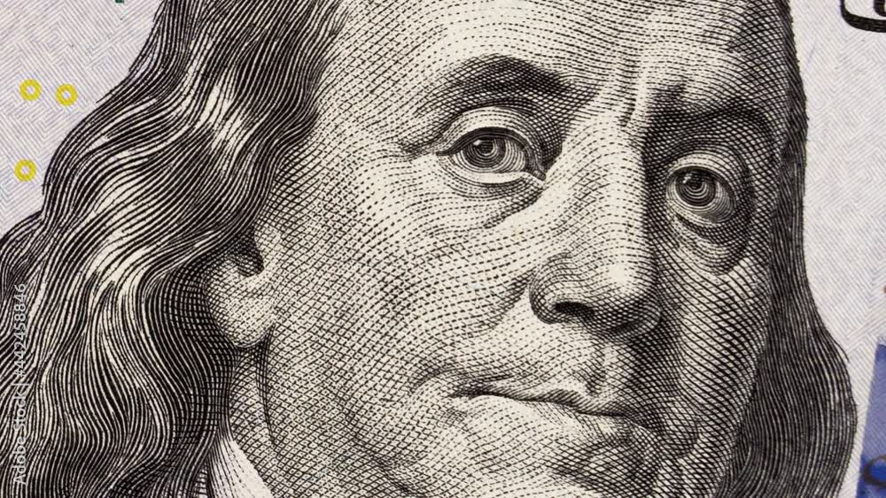 Portrait of Benjamin Franklin on hundred dollar bill. Seamless loop 16-bit depth. Smile and ...