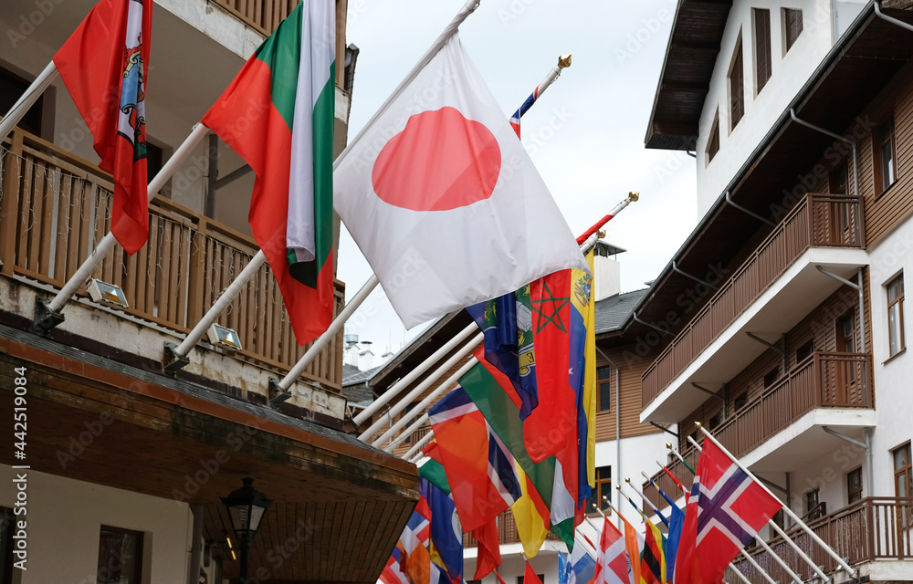 Foto de Many national flags of different states hang and blowing on ...