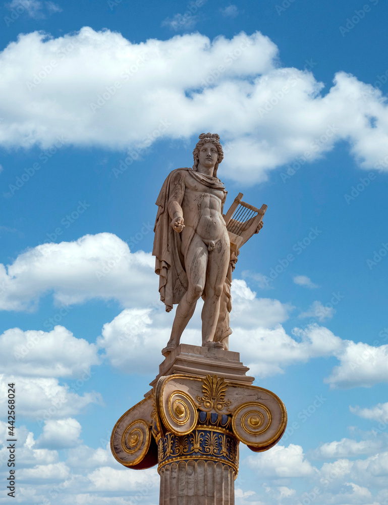 Apollo ancient Greek god statue and blue sky with some white clouds ...