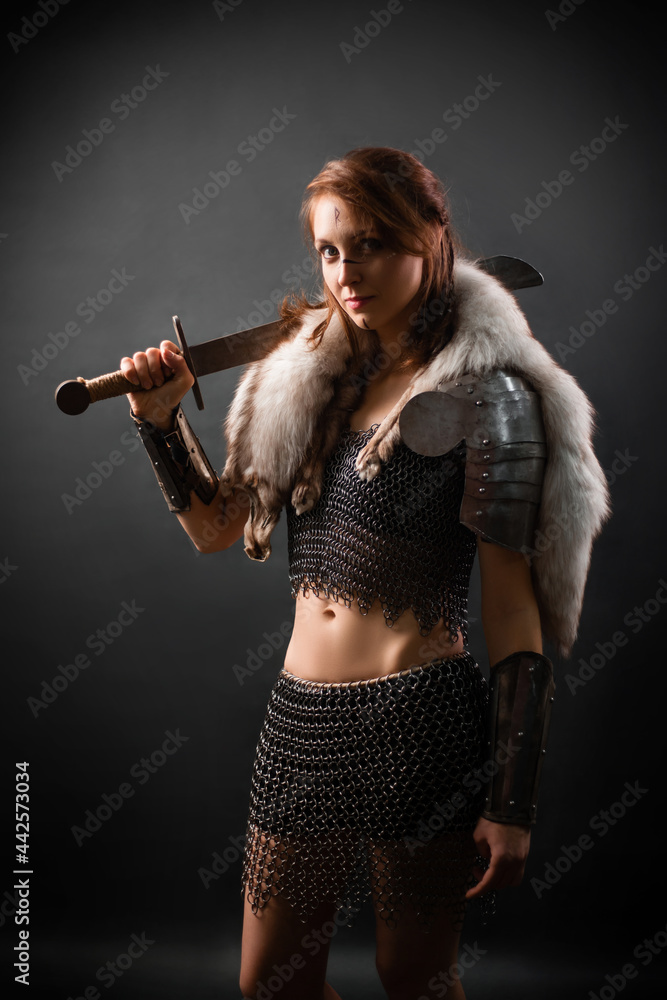 Portrait Of A Medieval Woman Warrior In Chain Mail Armor And Polar Fox