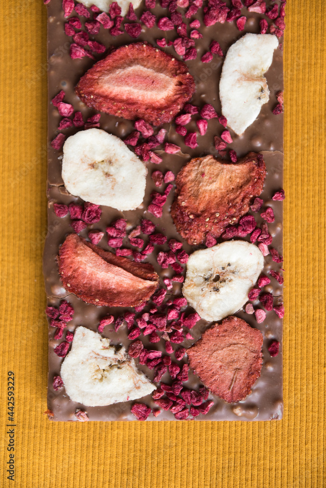 a bar of delicious milk chocolate with additions of dry raspberries and ...
