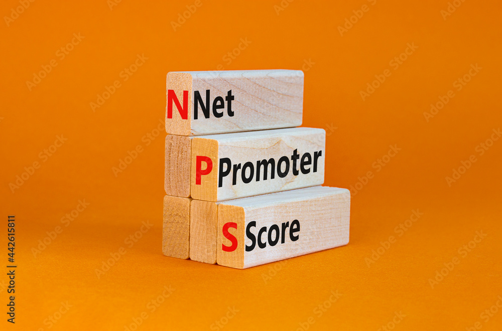 NPS net promoter score symbol. Wooden blocks with words 'NPS net ...