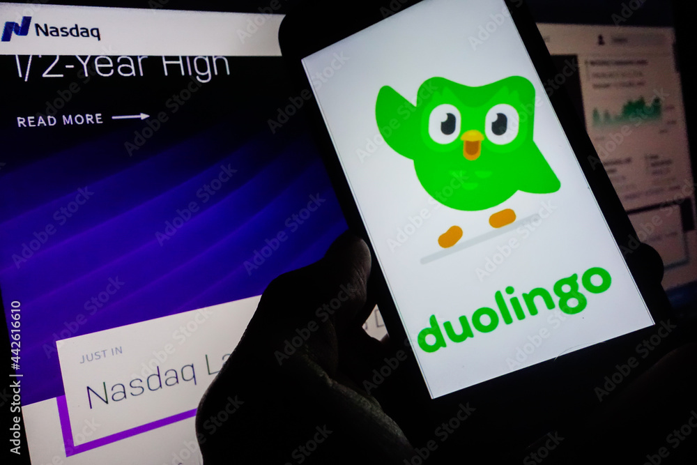 smartphone with Duolingo language app logo on screen and blurred ...