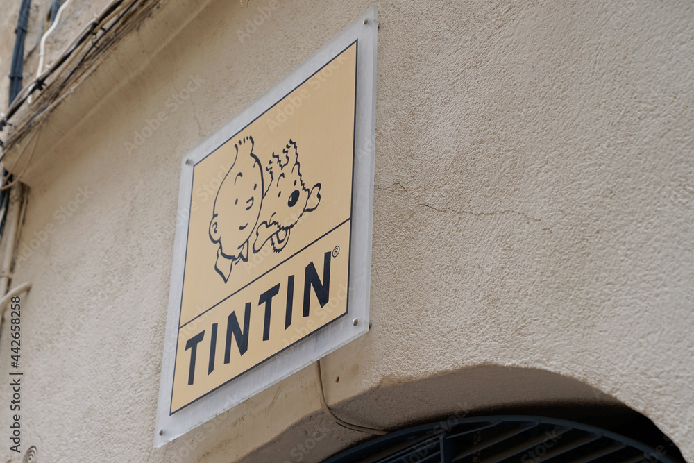 Tintin logo text and brand sign store of comic hero shop sell book ...