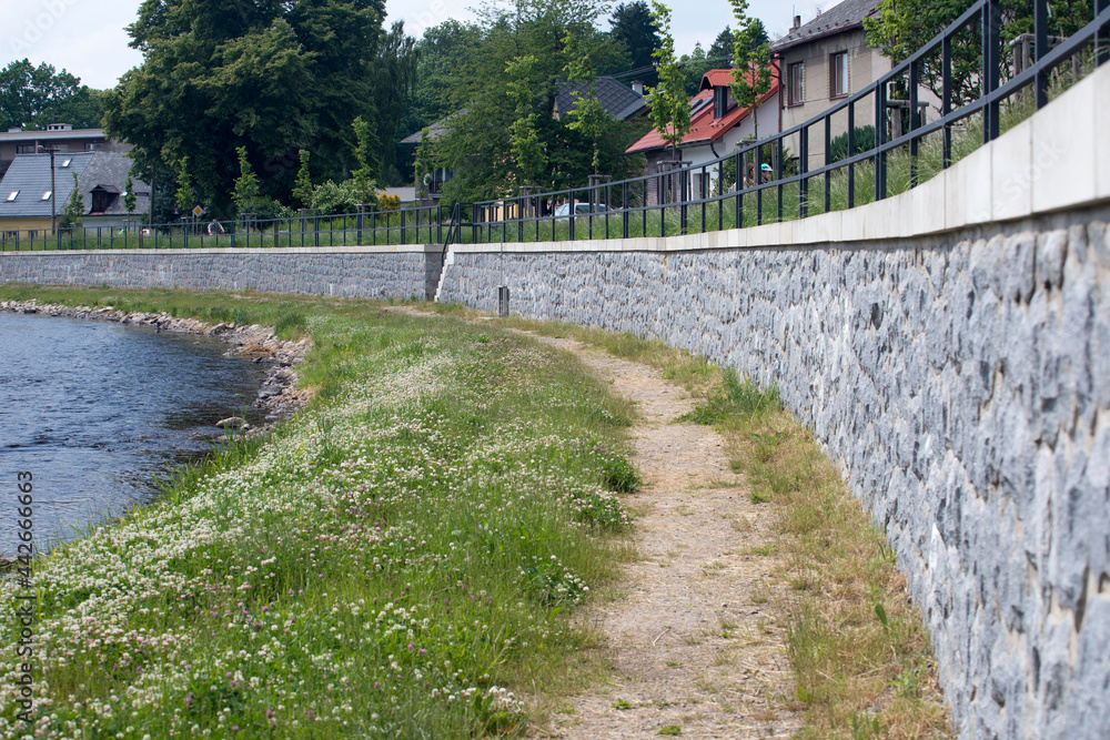 Modern flood protection wall in the style of the historic city wall ...