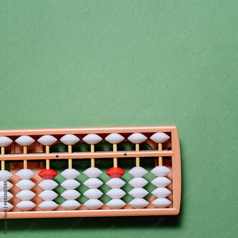 Japanese traditional abacus soroban on green background. Education and ...