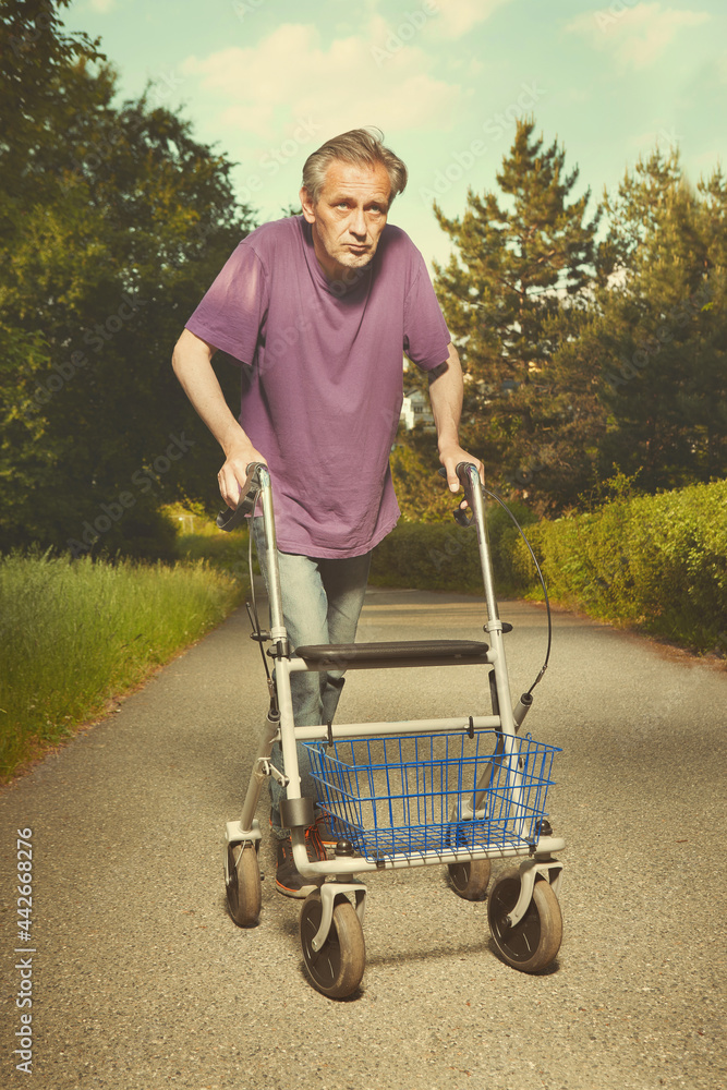 Older man on city sidewalk with his four wheel rollator walker Stock ...