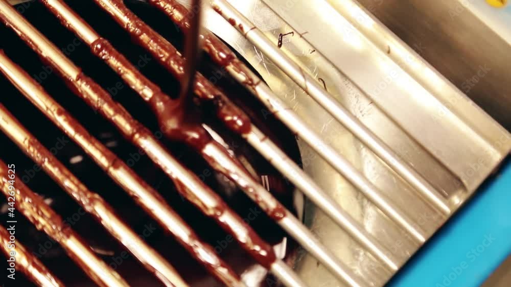 Chocolate factory. How craft chocolate is made. Hot chocolate is poured ...