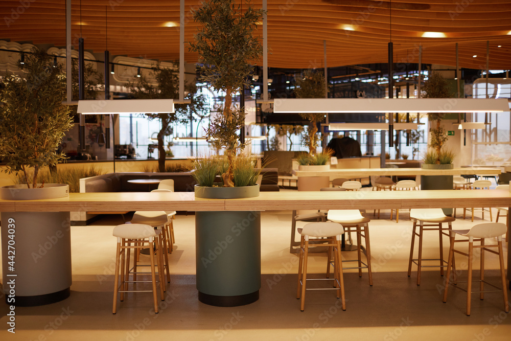 Wide angle background image of empty food court interior at modern ...