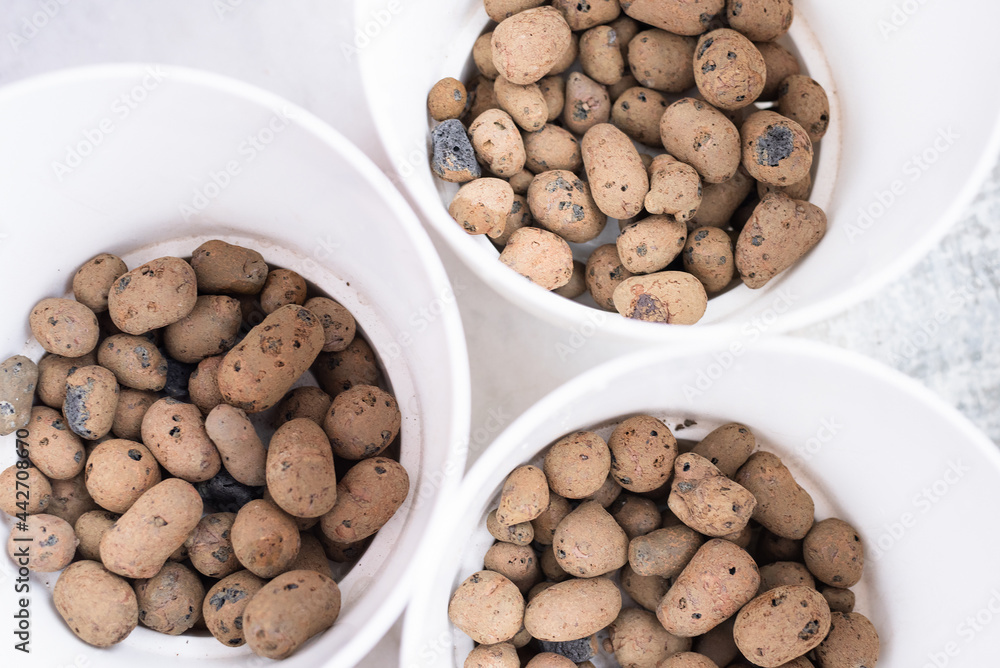 Expanded clay drainage in the flower pot top view background. Planting ...
