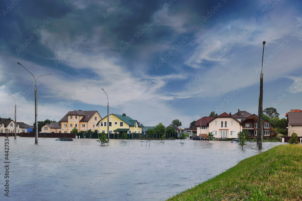 Extreme heavy rain storm weather. Flooded streets of the neighborhood ...