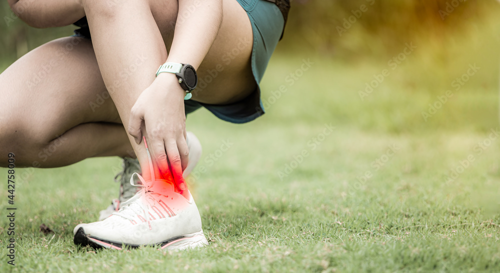 Sport woman has sore ankle from exercising training. It is a common ...