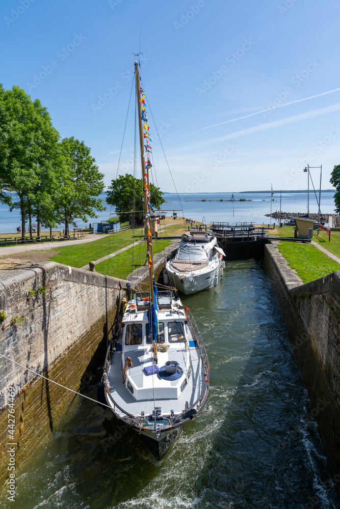 boats travelling upriver in the locks and sluices of the Gota Canal ...