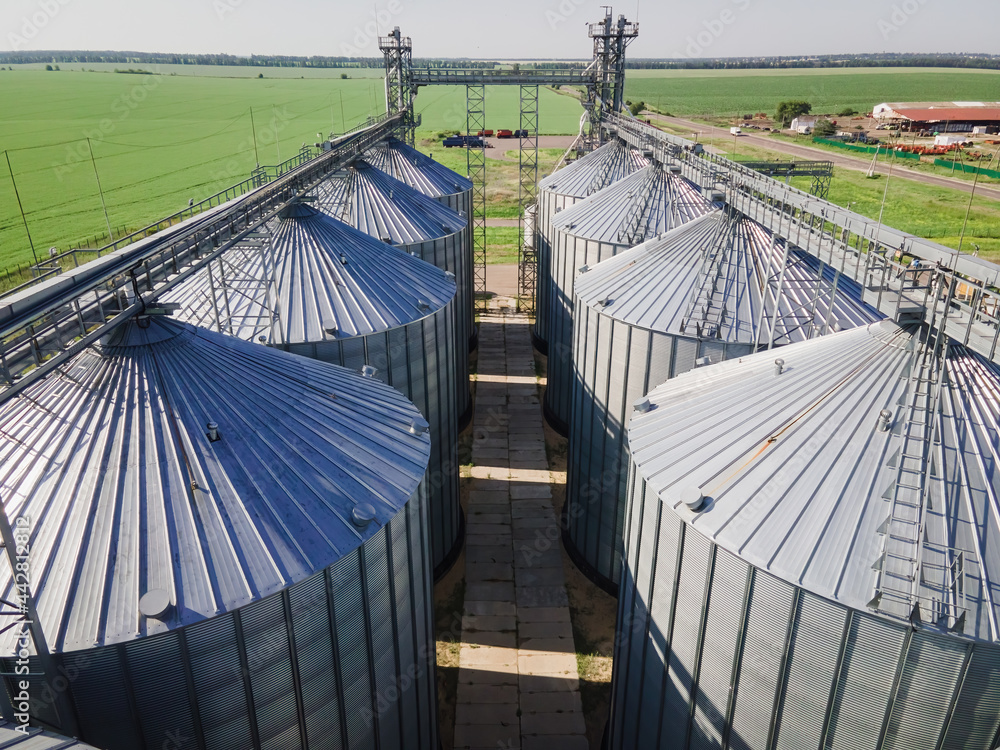 Silos on agro manufacturing plant for processing drying cleaning and ...