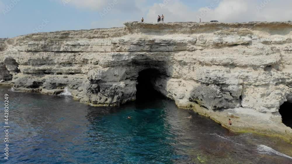 Aerial view of a grotto in sheer cliff, Cape Tarkhankut, Black Sea ...