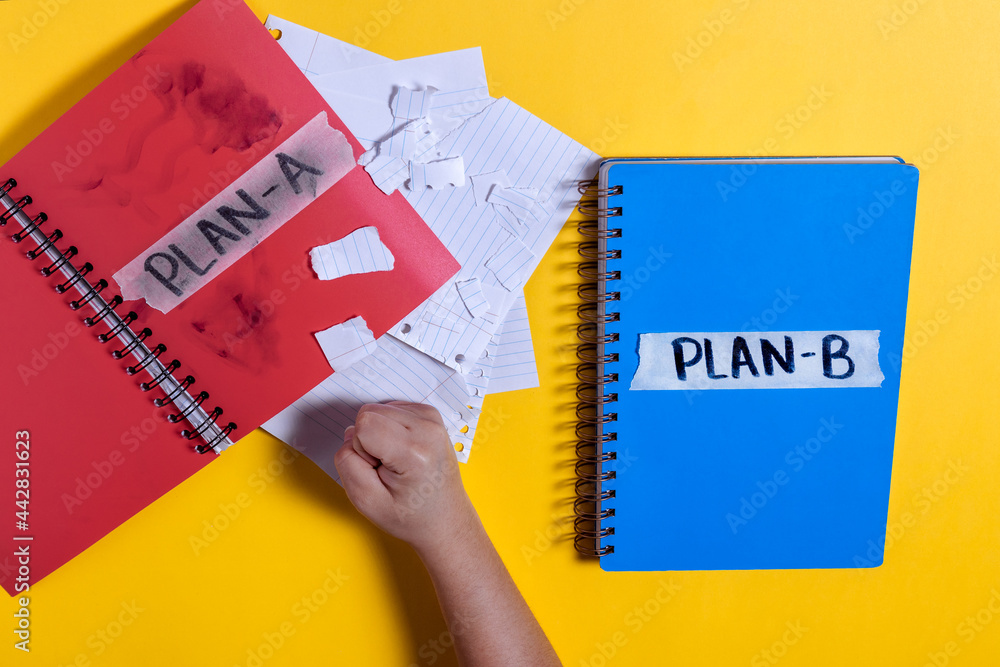 Hand pushed over messy and destroyed sheets, which are underneath a ...