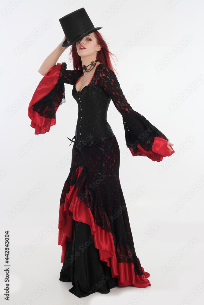 full length portrait of red haired woman wearing long black gothic ...